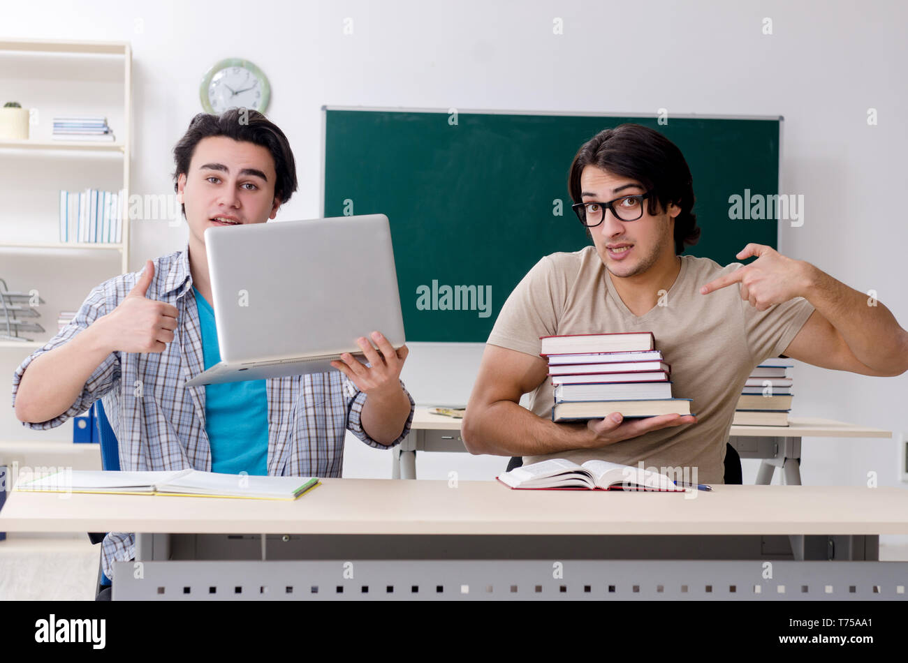 Two male students in the classroom Stock Photo - Alamy