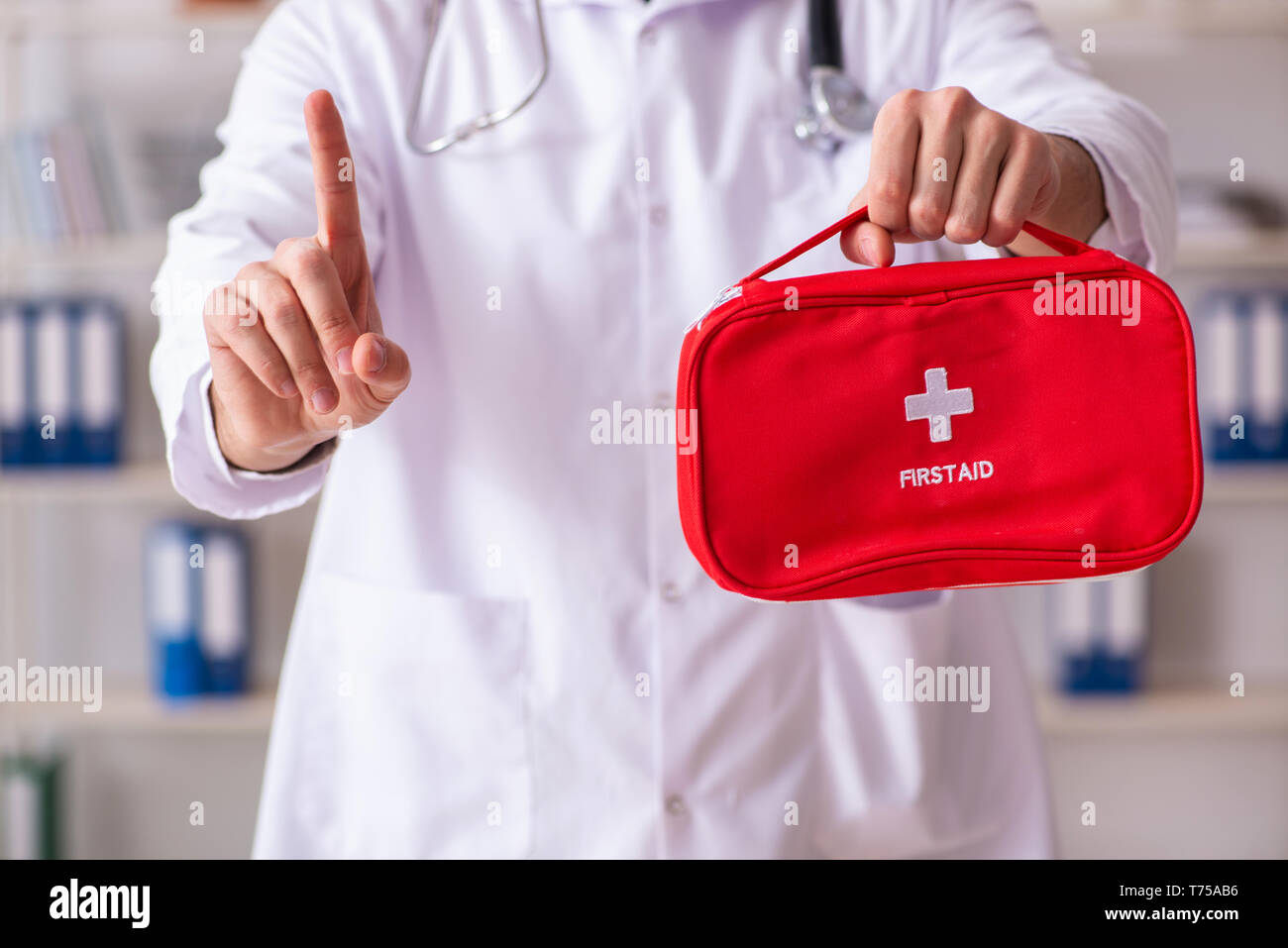 Male doctor with first aid bag Stock Photo - Alamy