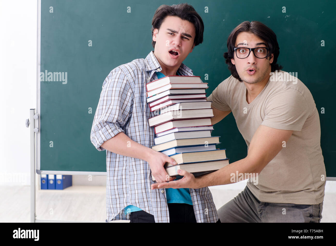 Two male students in the classroom Stock Photo - Alamy