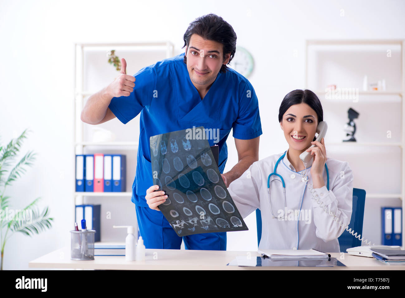 Two young doctors working in the clinic Stock Photo - Alamy