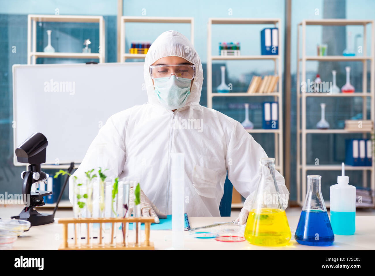 Male biotechnology scientist chemist working in the lab Stock Photo - Alamy