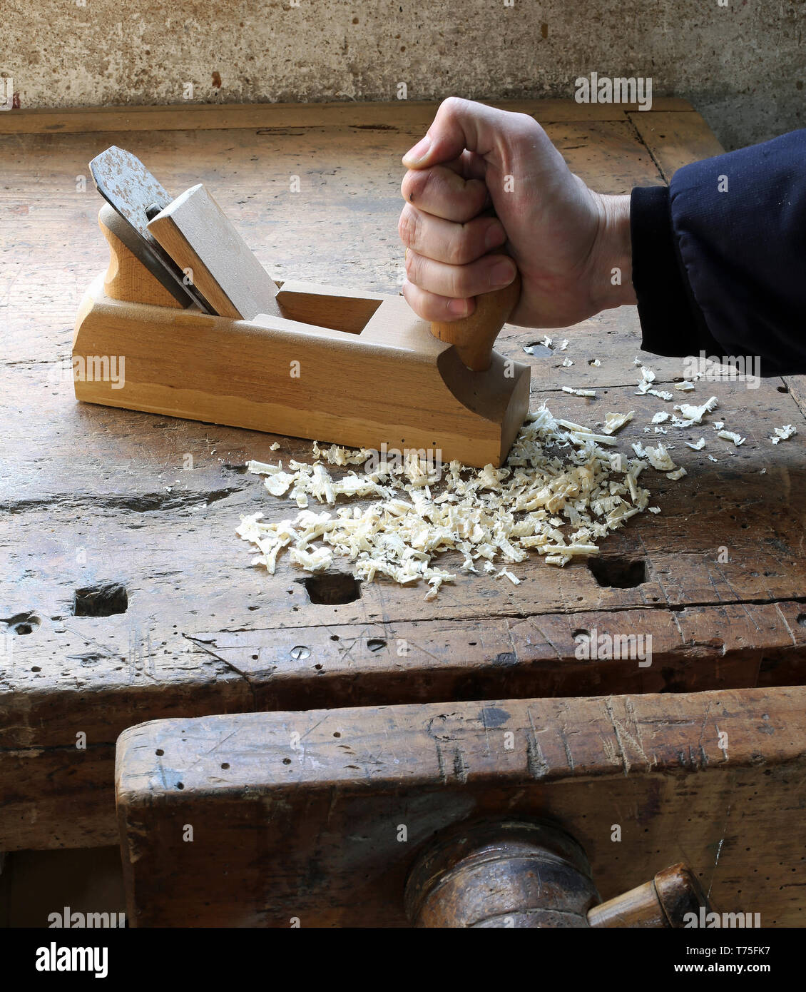 Carpenter's hand in the carpentry workshop with a plane a Stock Photo ...