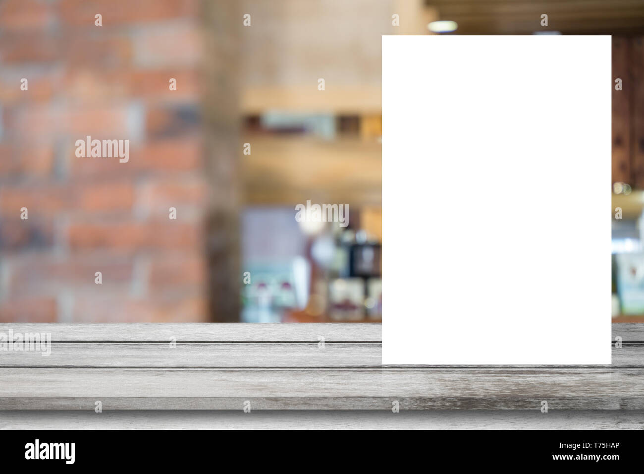 White mockup poster on top of wood table at the restaurant Stock Photo ...