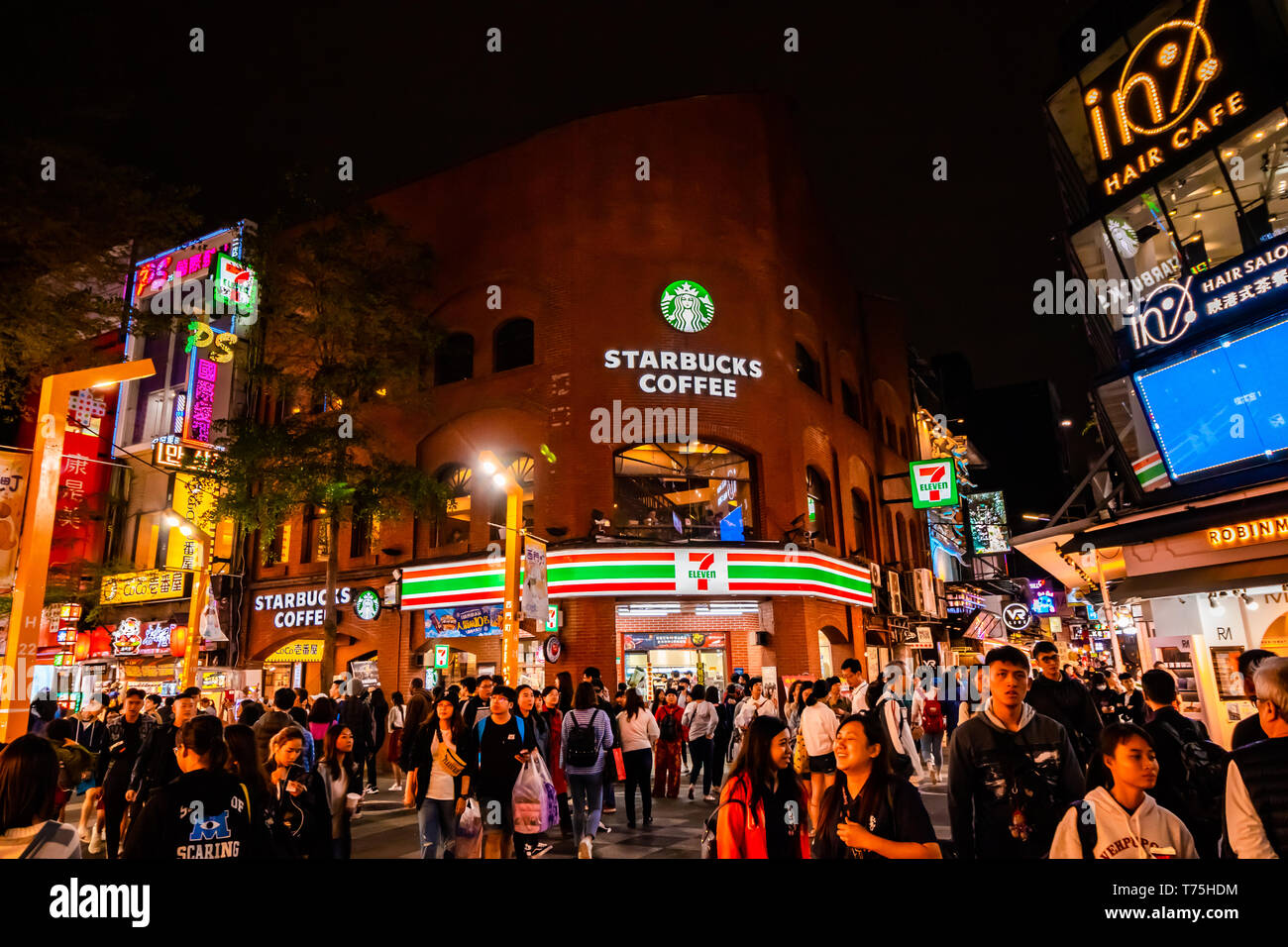 Crowd of shopper walking in front of Starbucks Coffee in Ximending ...