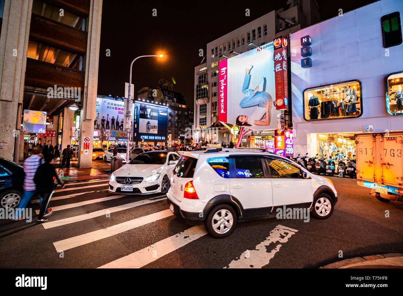 Cars in queue and waiting in front of a parking lots in Ximending ...
