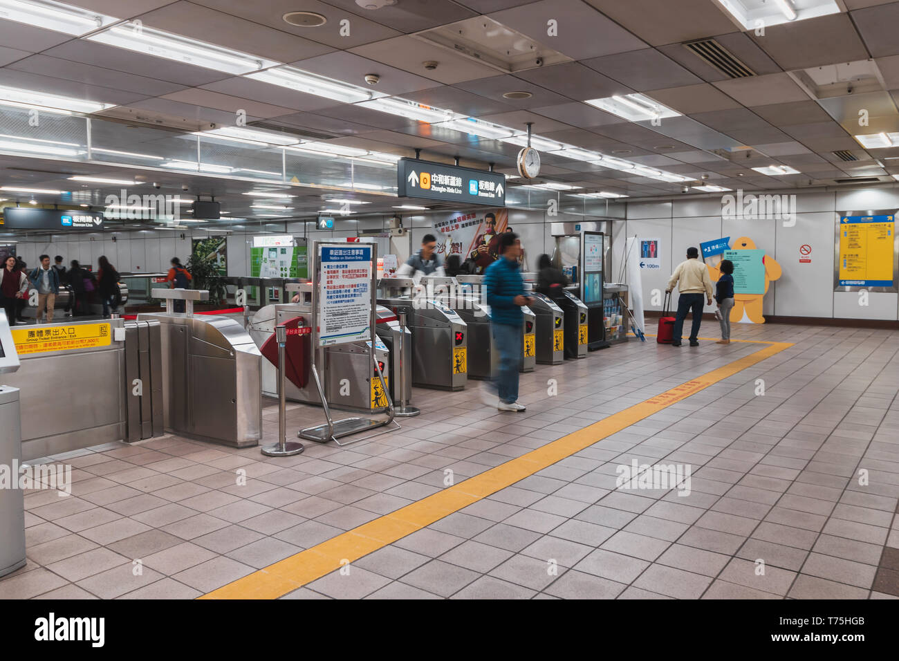 Motion blur of Crowd of commuter passing through ticket gate and enter ...