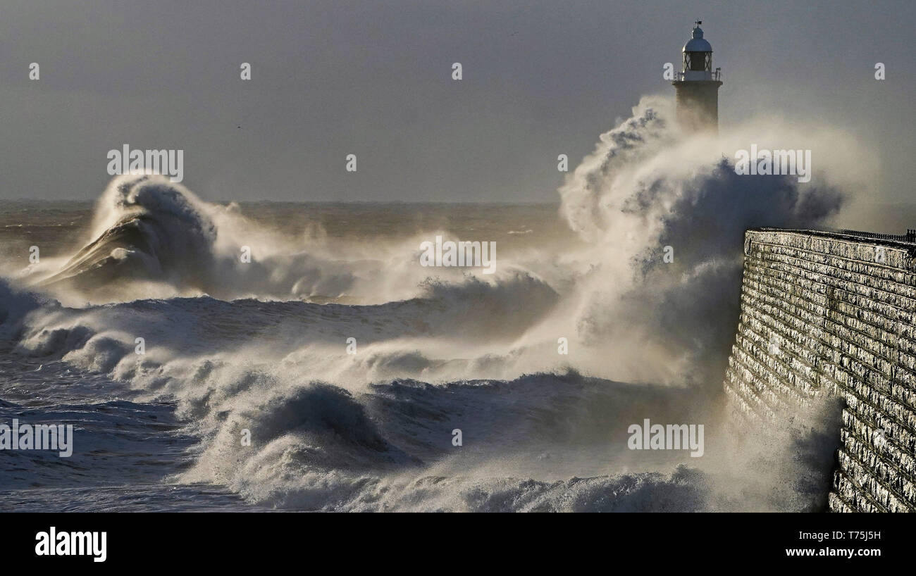 Waves crash over sea wall tynemouth hi-res stock photography and images ...