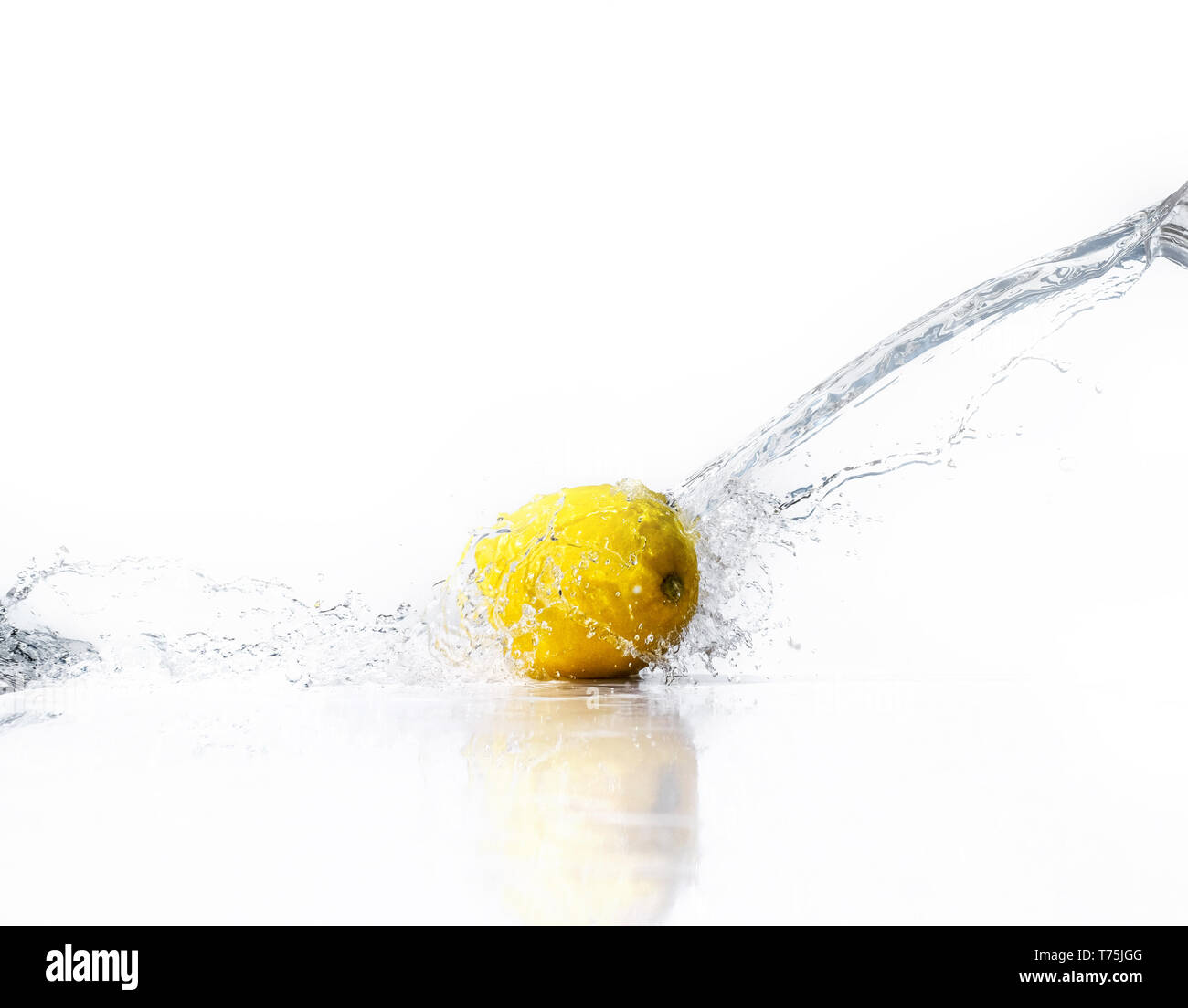 Yellow lemon in water splash on white background Stock Photo - Alamy