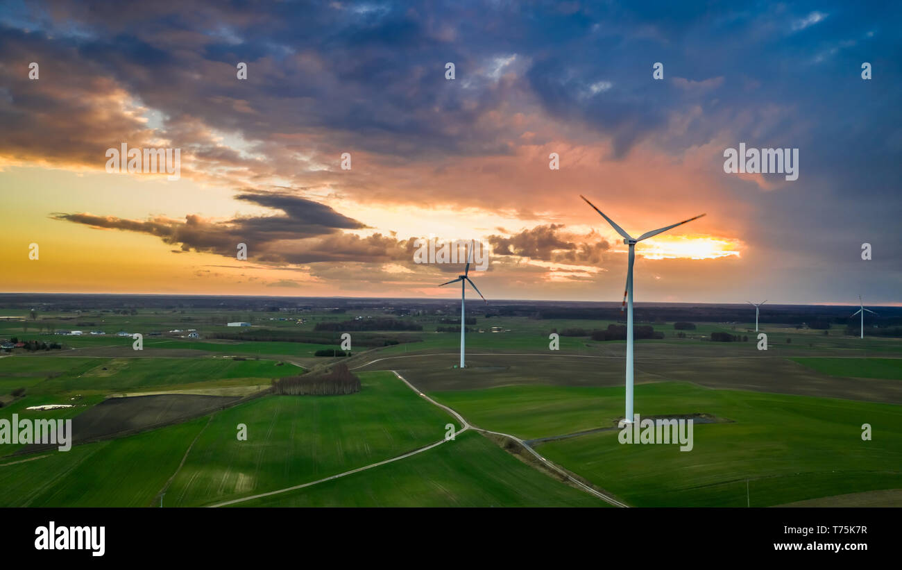 Wind turbines sunset above clouds hi-res stock photography and images ...
