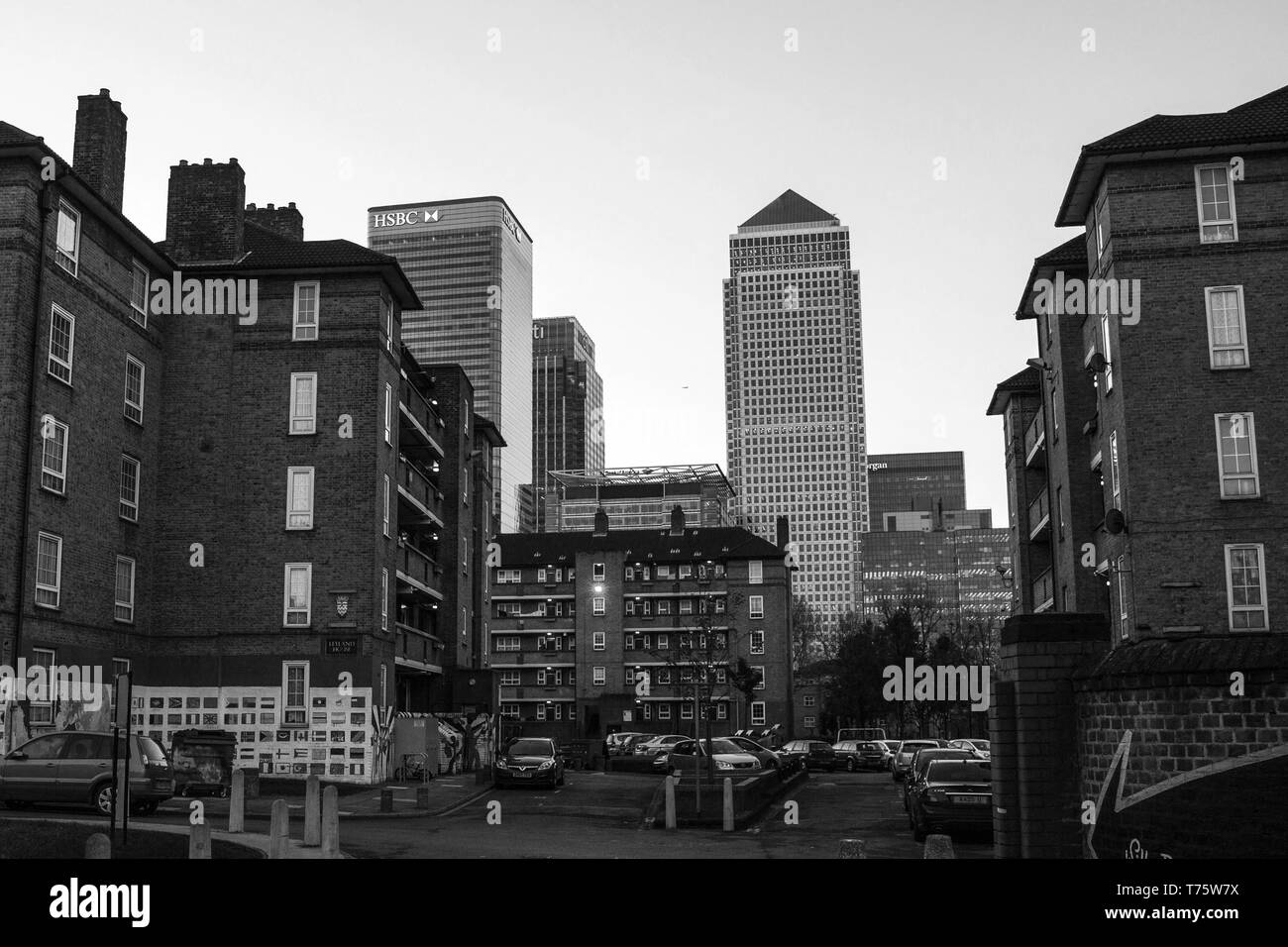 A Tower Hamlets estate is pictured with HSBC tower of Canary Wharf in ...