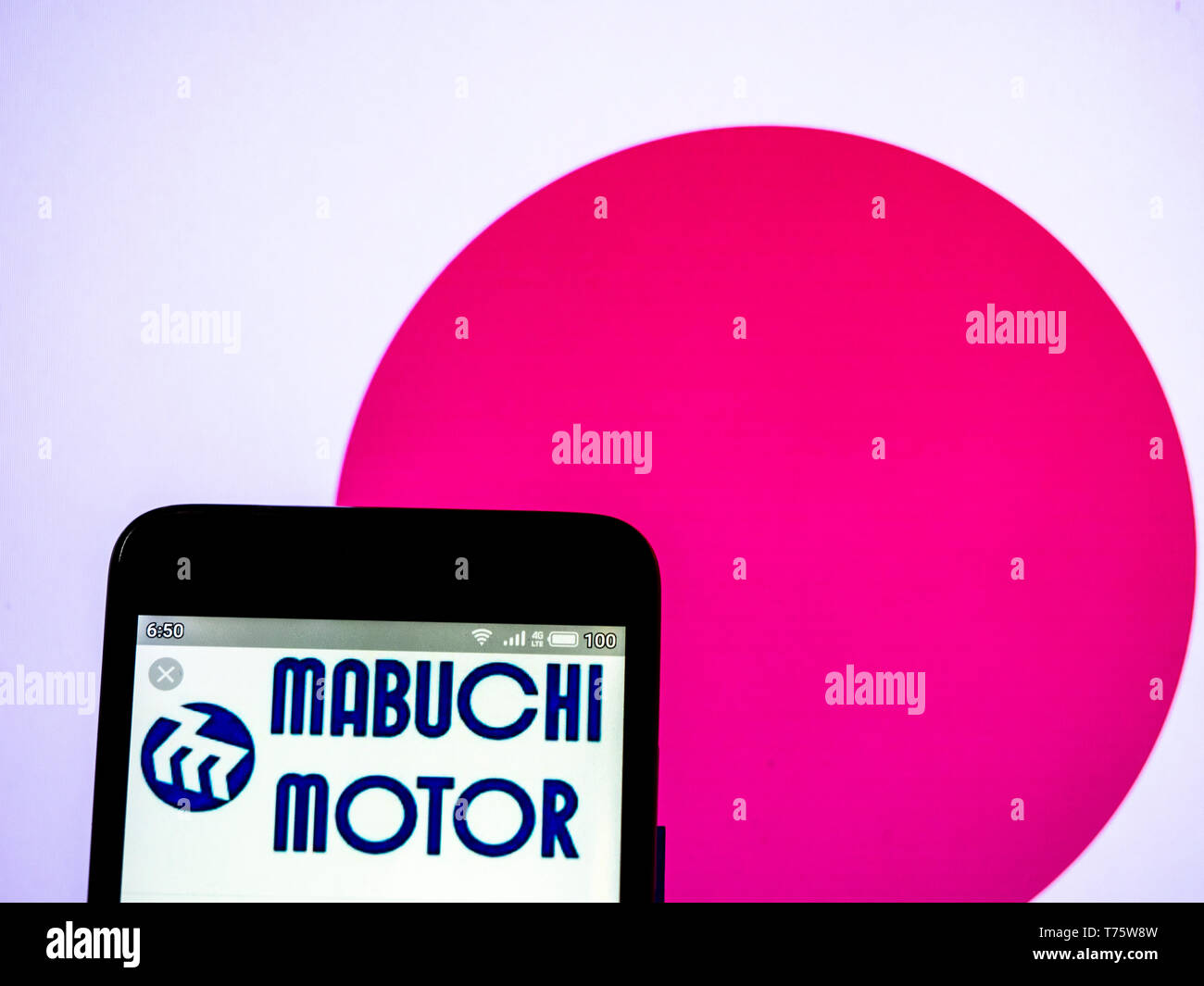 In this photo illustration a Mabuchi Motor Company logo seen displayed ...