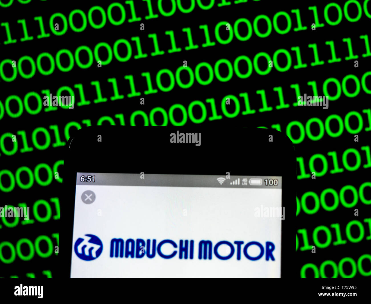 In this photo illustration a Mabuchi Motor Company logo seen displayed ...