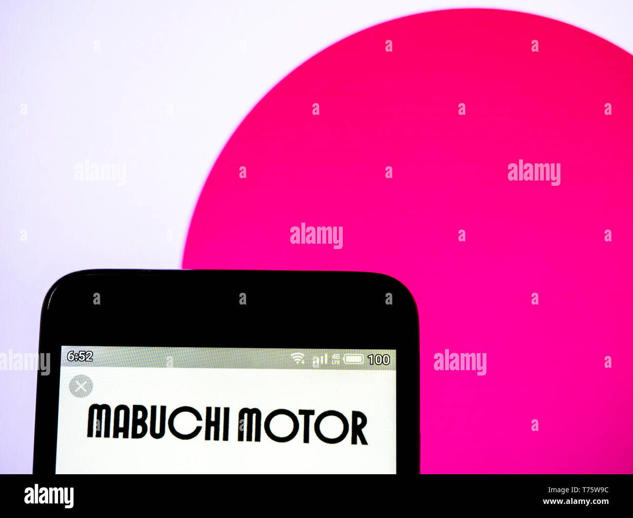 In this photo illustration a Mabuchi Motor Company logo seen displayed ...