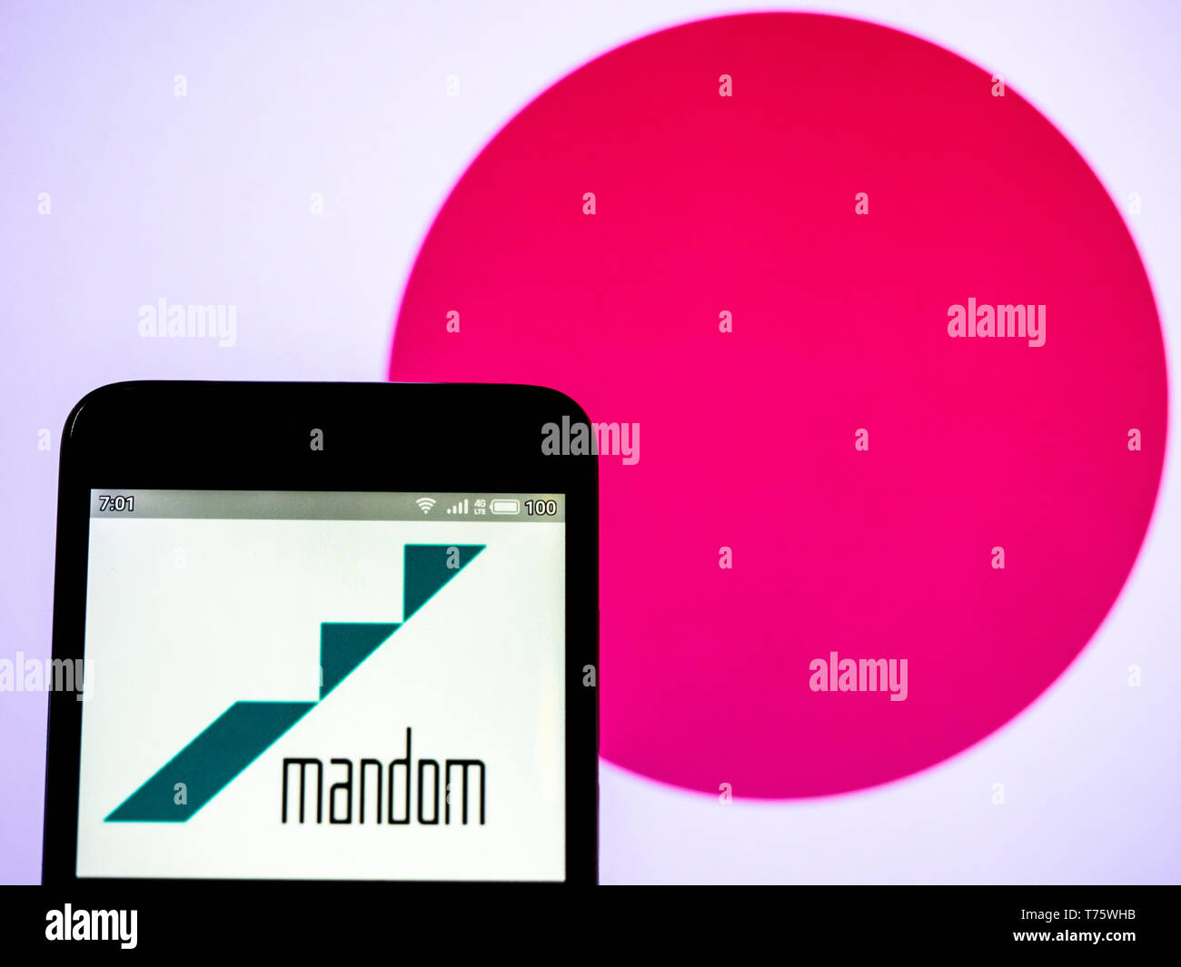 In this photo illustration a Mandom Corporation logo seen displayed on ...