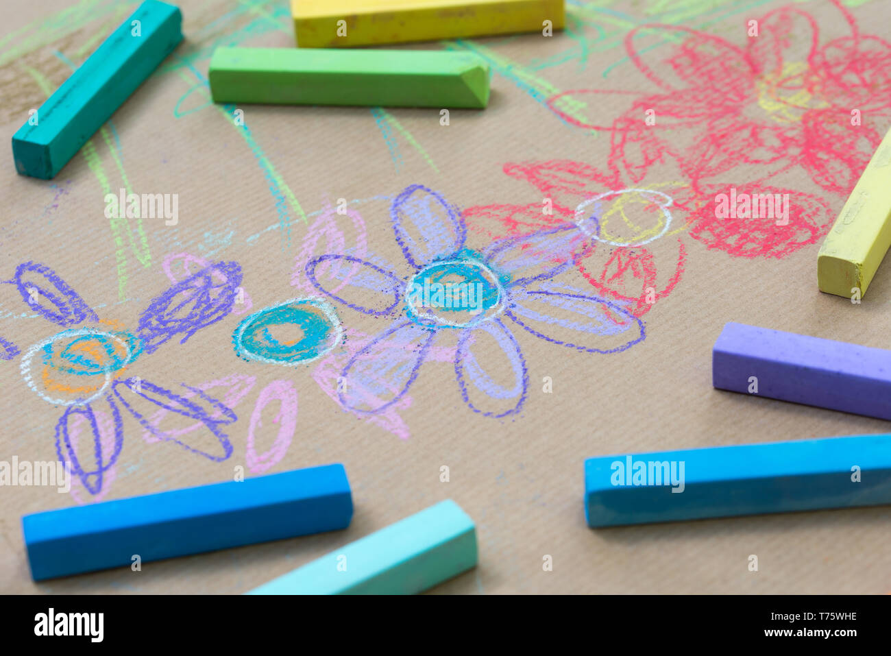 hand drawing on recycled paper - colorful flowers macro Stock Photo - Alamy