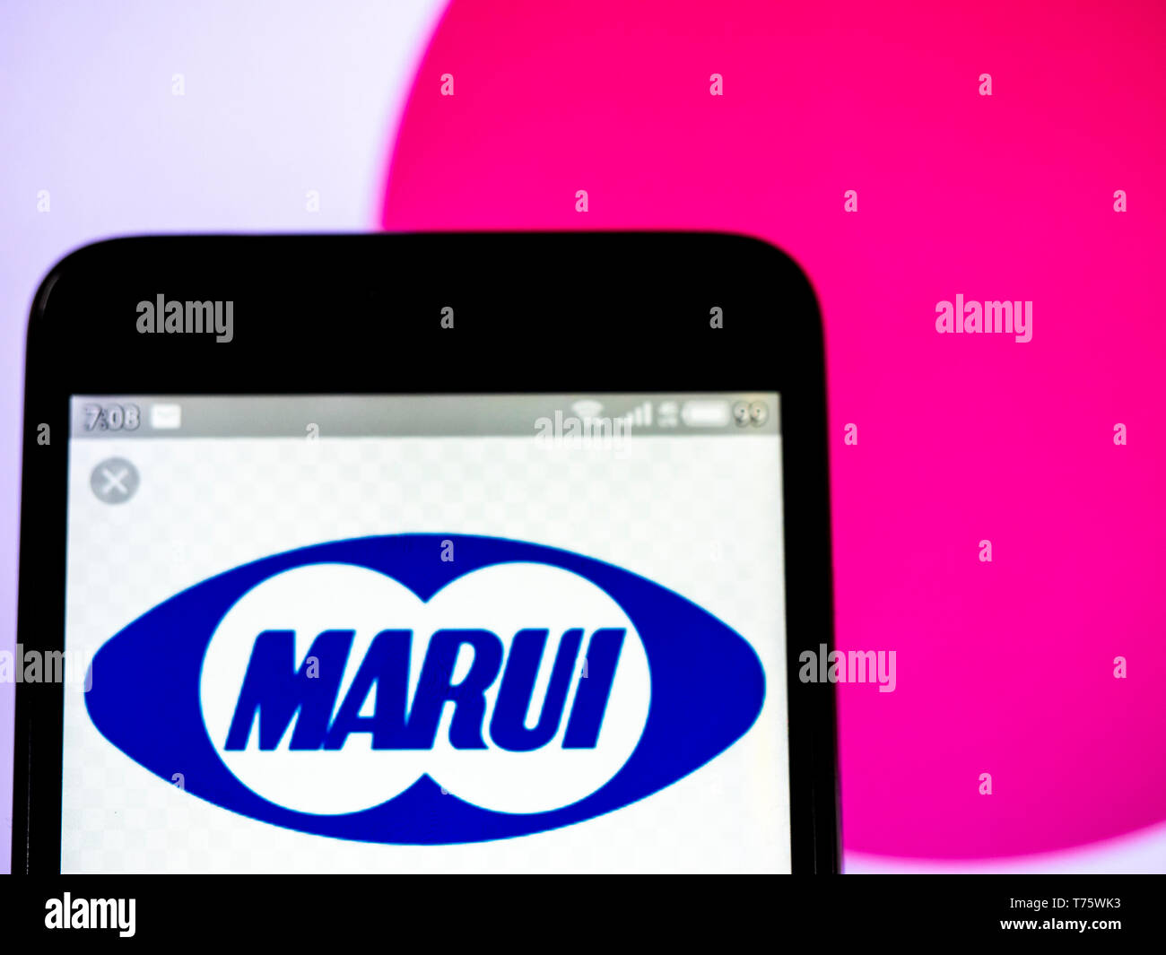 In this photo illustration a Marui Co., Ltd. logo seen displayed on a ...