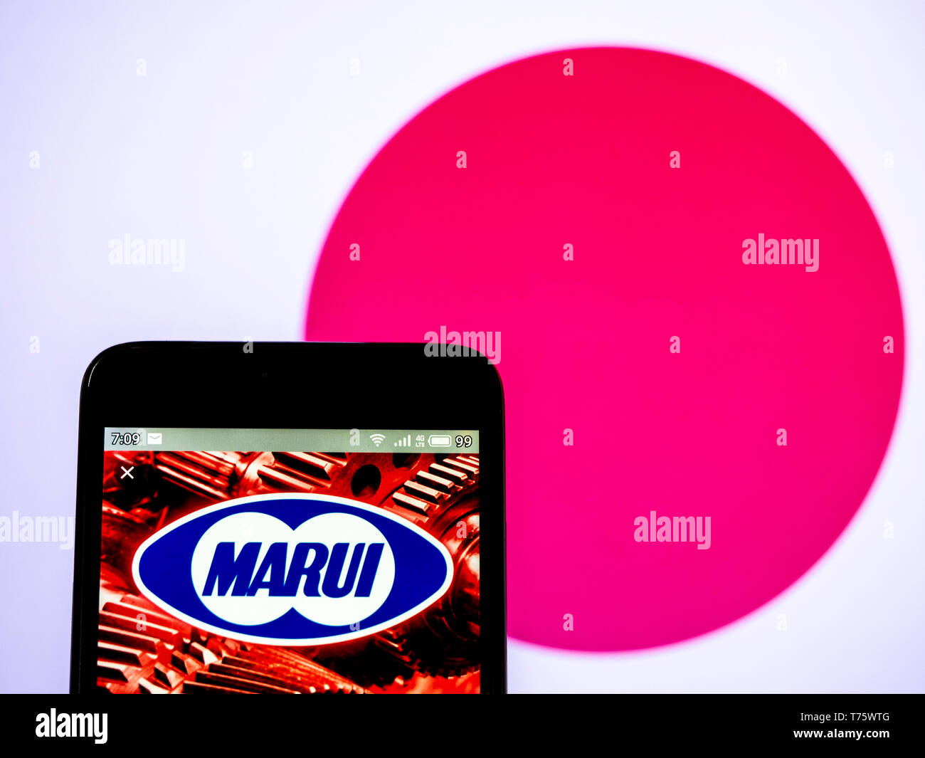 In this photo illustration a Marui Co., Ltd. logo seen displayed on a ...