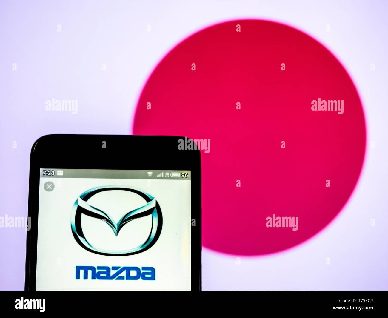 In this photo illustration a Mazda Motor Corporation logo seen ...