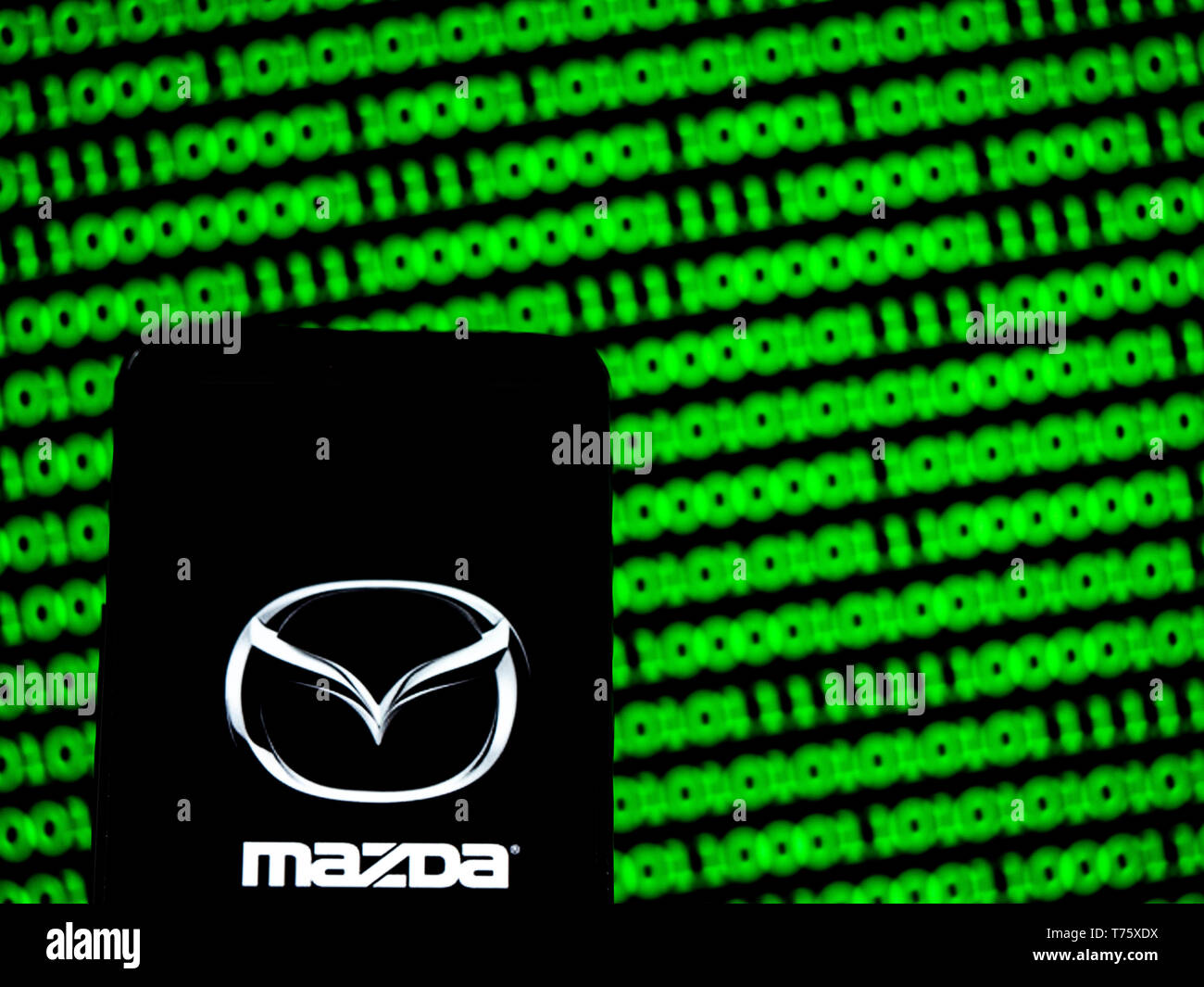 In this photo illustration a Mazda Motor Corporation logo seen ...