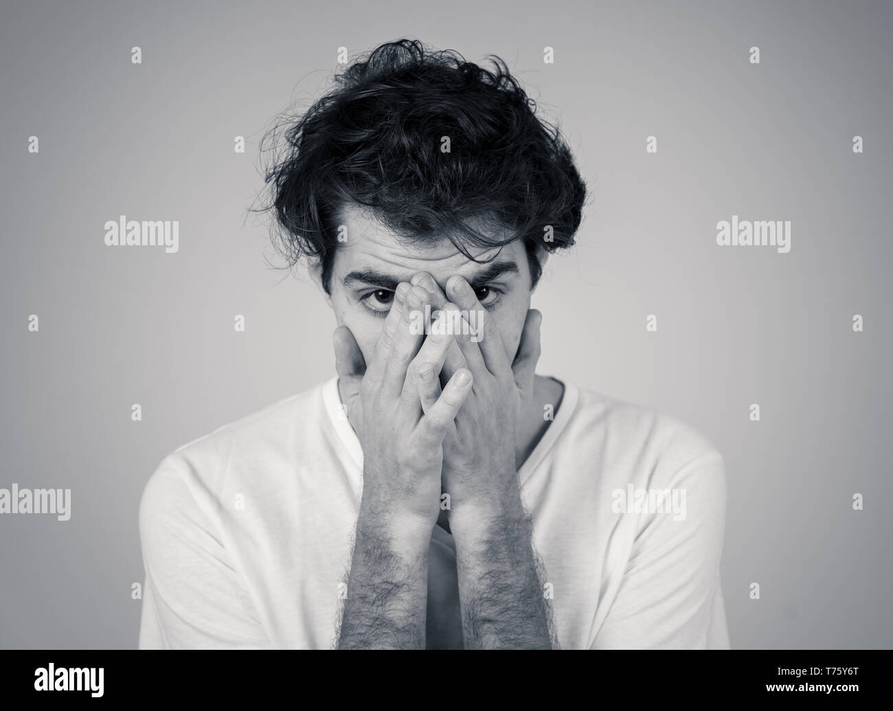 Portrait of young sad man crying in emotional pain looking desperate ...