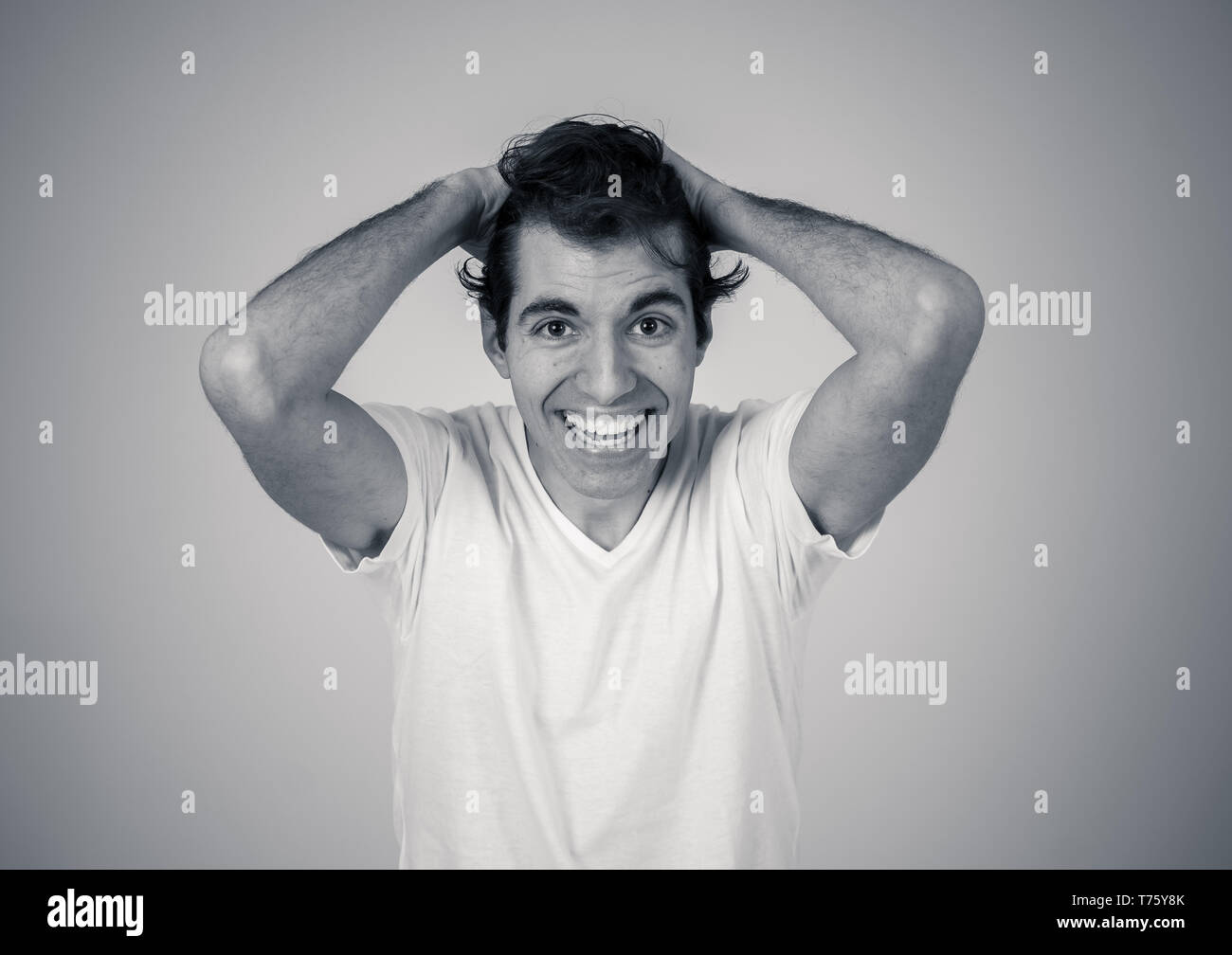 Portrait of Amazed excited funny Man achieving his goal or wining ...