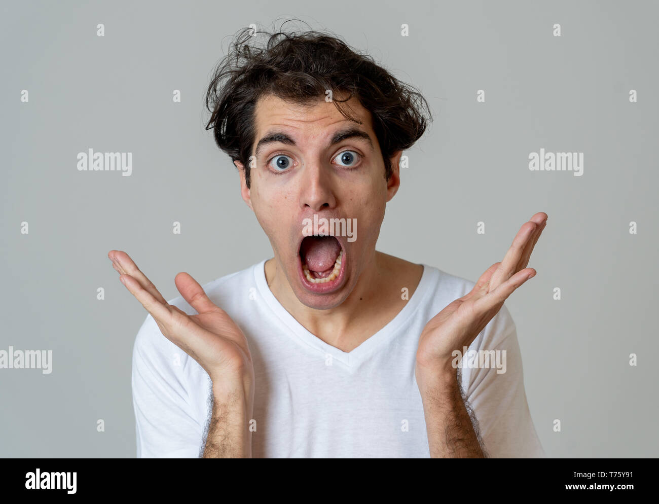Portrait of Amazed excited funny Man achieving his goal or wining ...