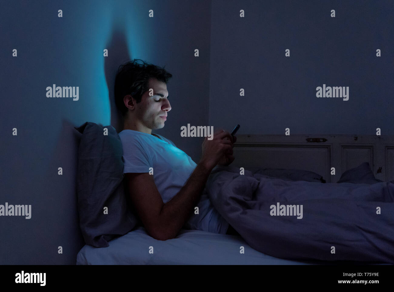 Man awake in bed late hi-res stock photography and images - Alamy
