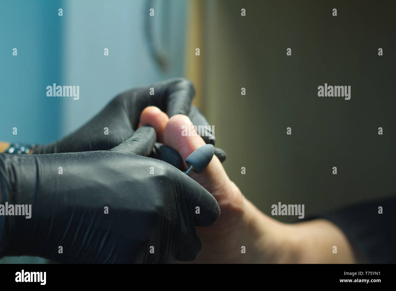 Professional hardware pedicure using electric machine.Patient on ...