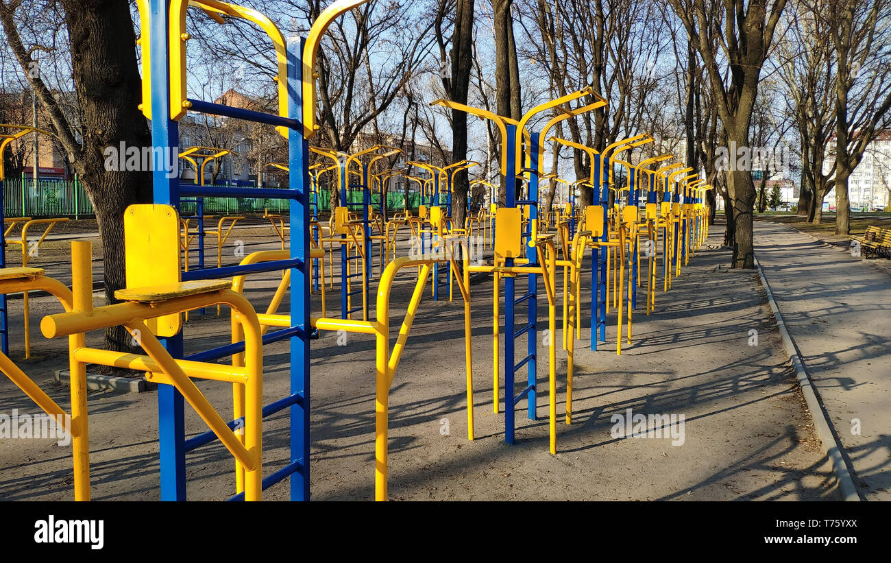 Yellow-blue exercise equipment located on the street for sports ...