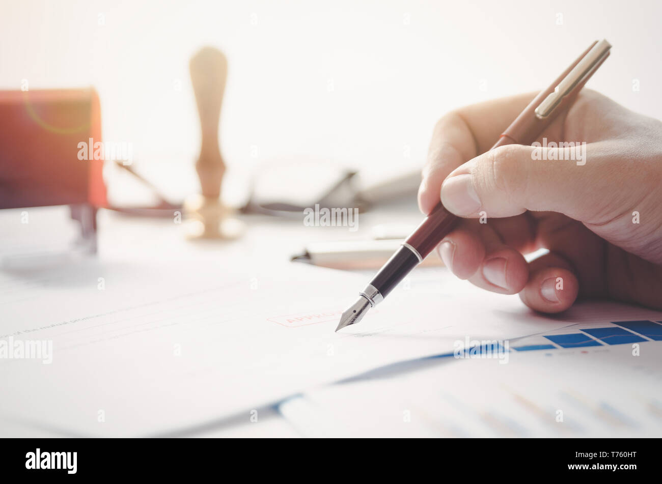 Notary signs legal contract. Attorney signing official document Stock ...