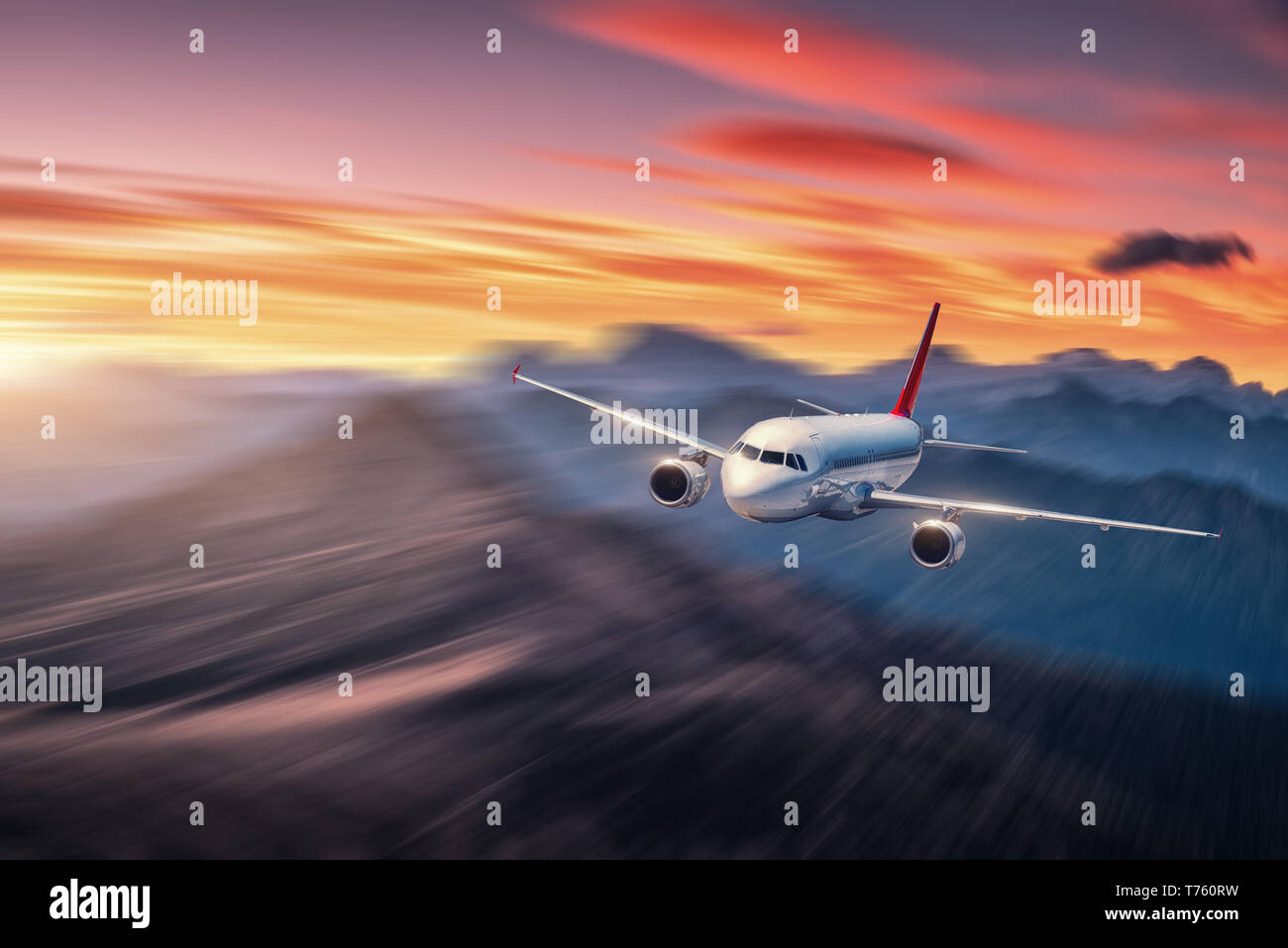 Airplane in motion. Aircraft with motion blur effect is flying over ...