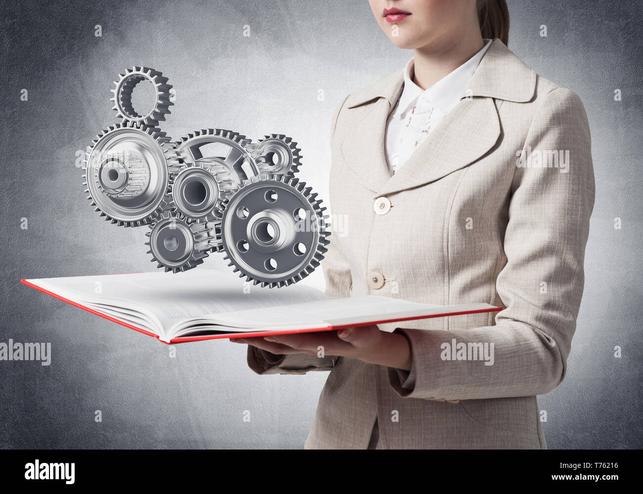 Woman showing abstract mechanism with cogwheels Stock Photo - Alamy
