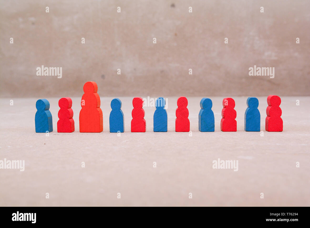 Busy mother. Large group of toy figures of children with mother figure ...
