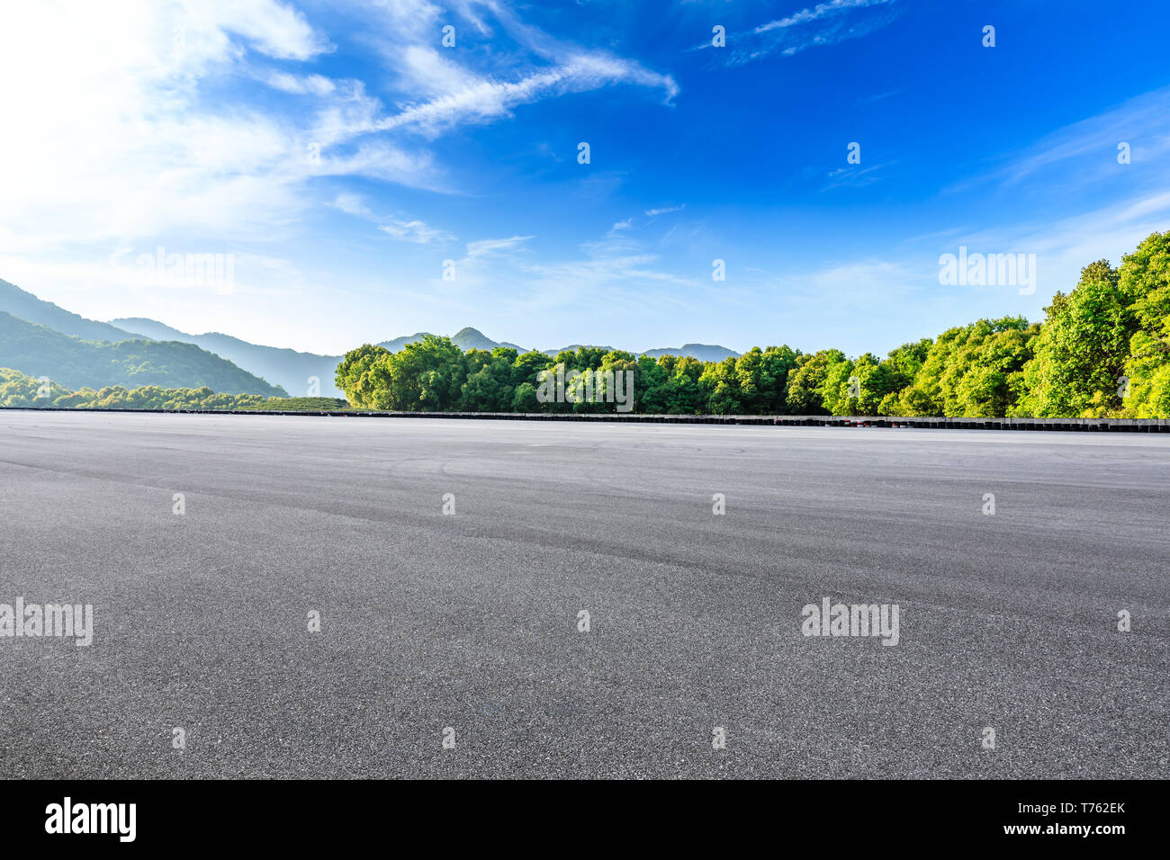 Empty asphalt race track and beautiful natural landscape Stock Photo ...