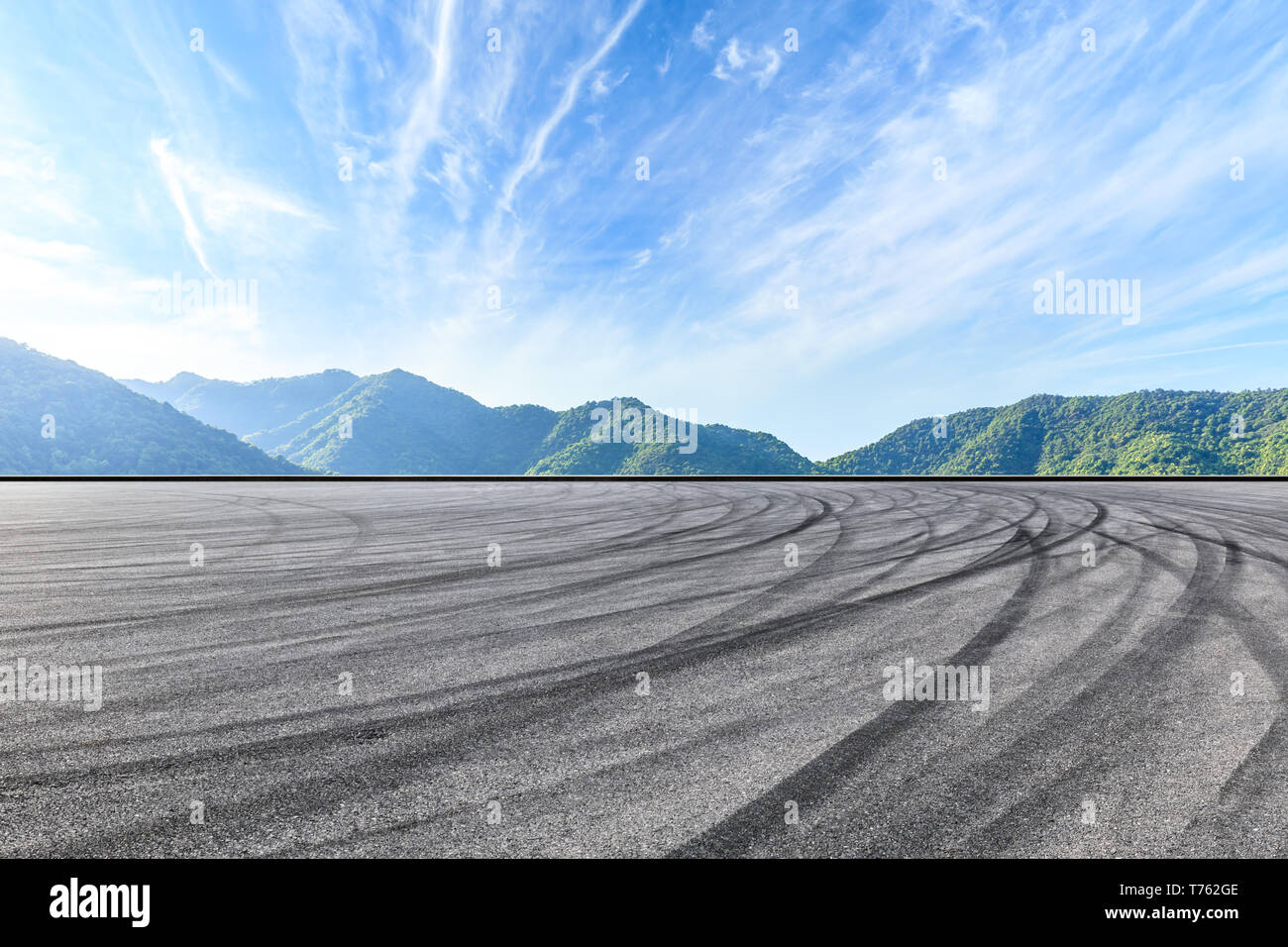 Empty asphalt race track and beautiful natural landscape Stock Photo ...