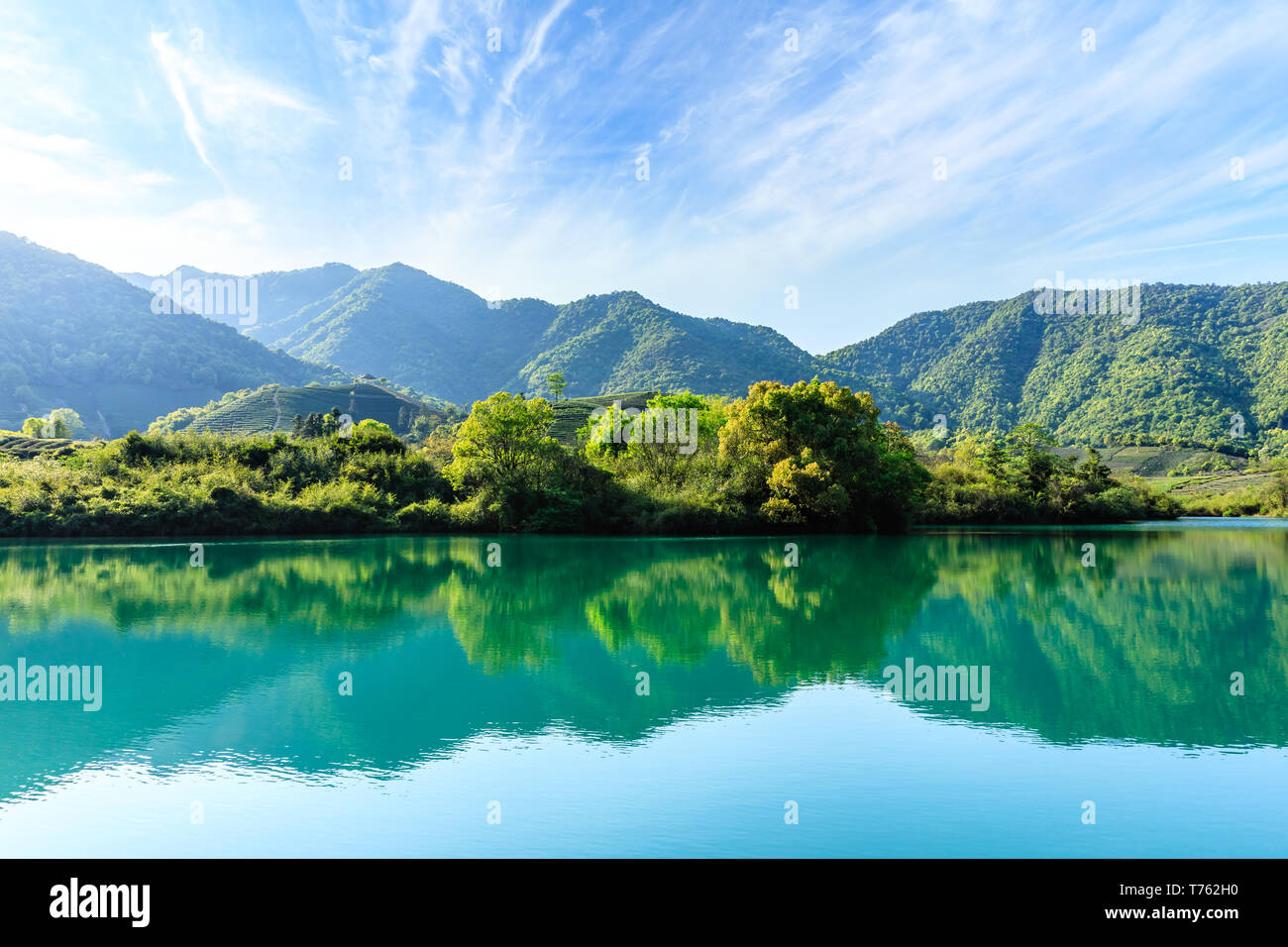 Beautiful mountains and green reflections Stock Photo - Alamy