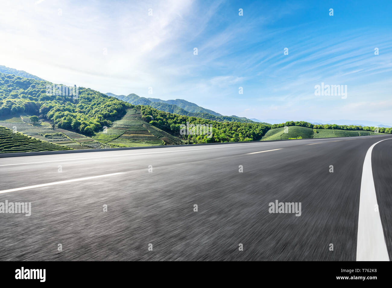 Motion blurred highway and beautiful natural landscape Stock Photo - Alamy