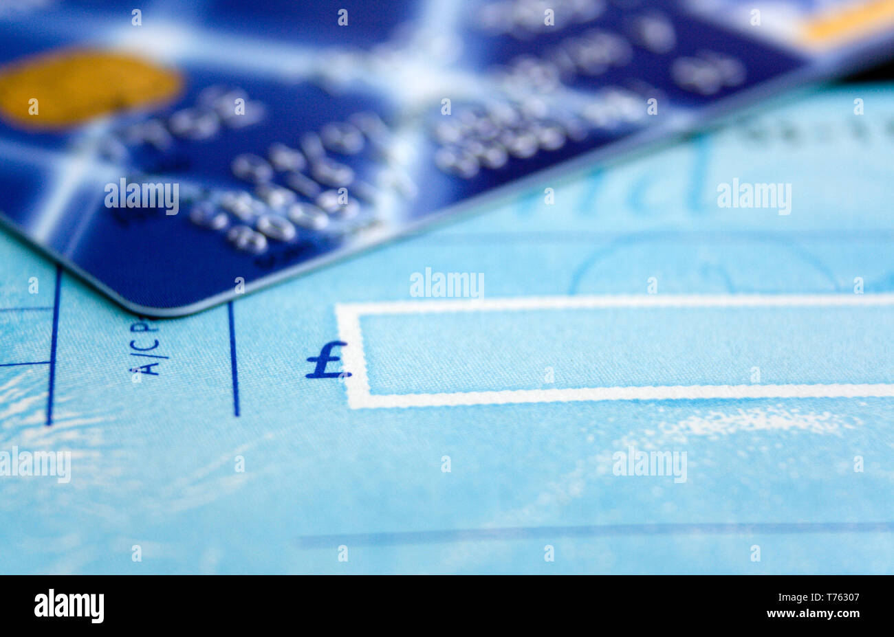 Cheque Book and Credit Card Close up, with focus on Pound Sign Stock ...