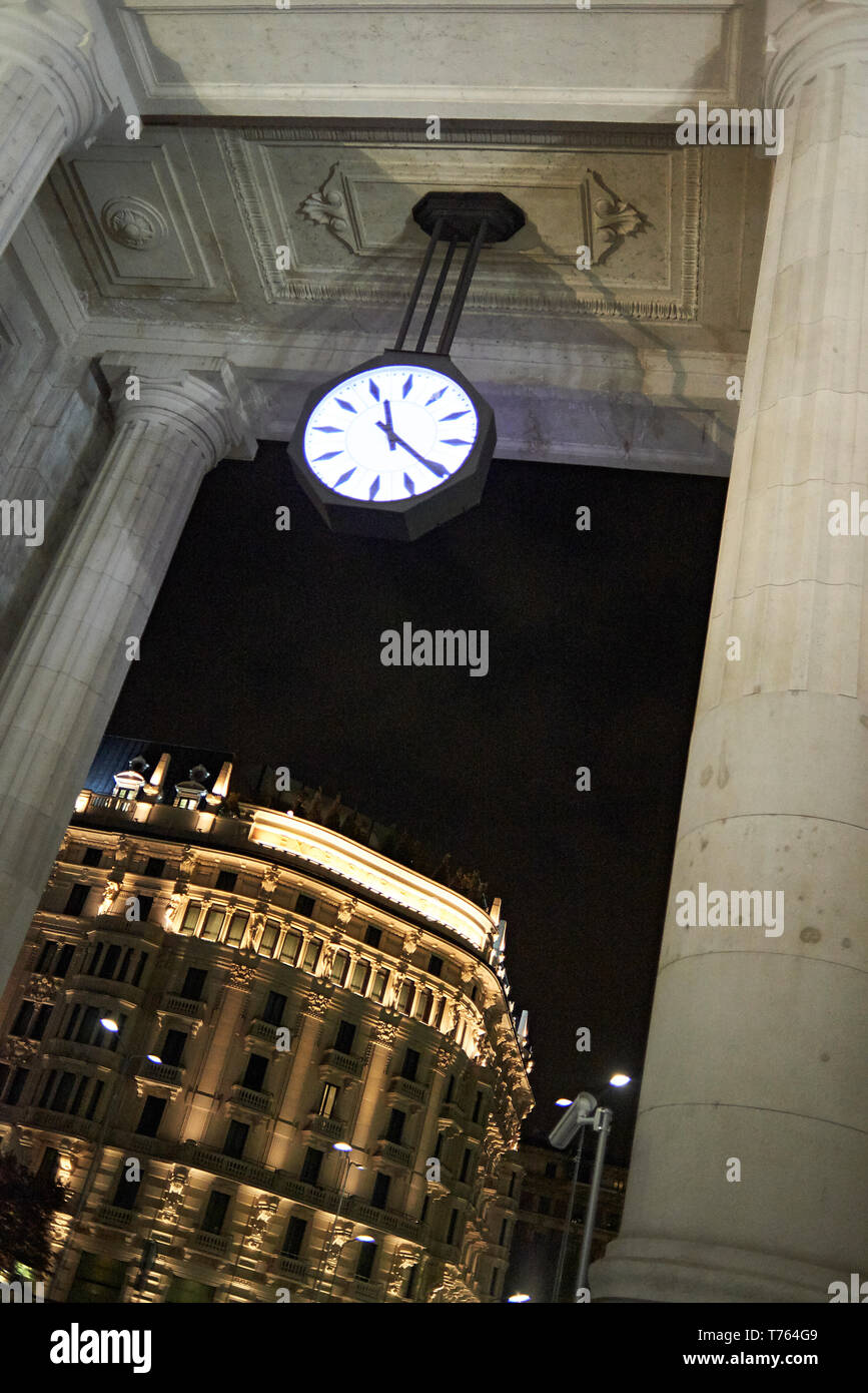 Clock hanging in central station in Milan, Italy with grand marble ...