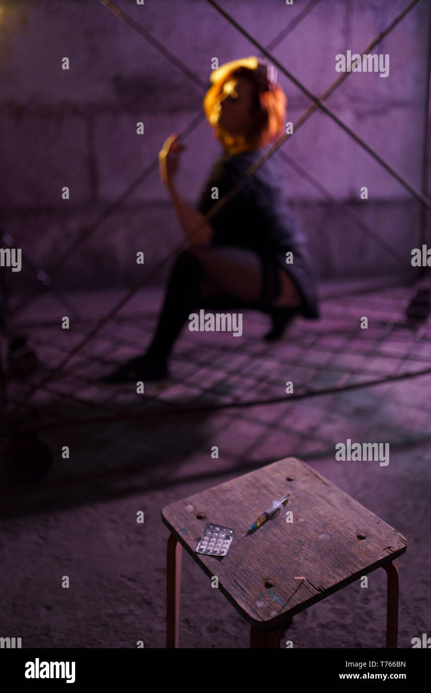Filled Syringe and Pills on a table - Underground nightclub party ...