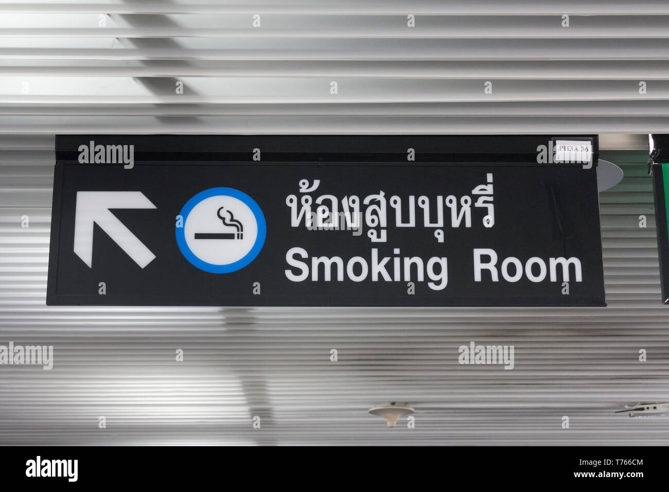 Smoking room sign in an airport Stock Photo - Alamy