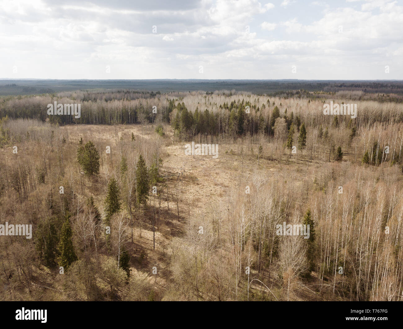 aerial view of countryside fields and forests with small lakes in ...