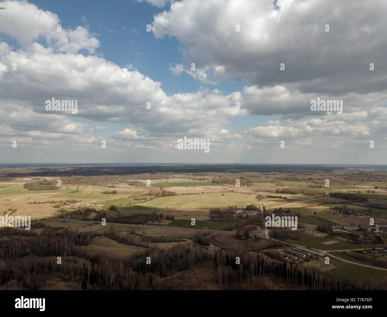 aerial view of countryside fields and forests with small lakes in ...