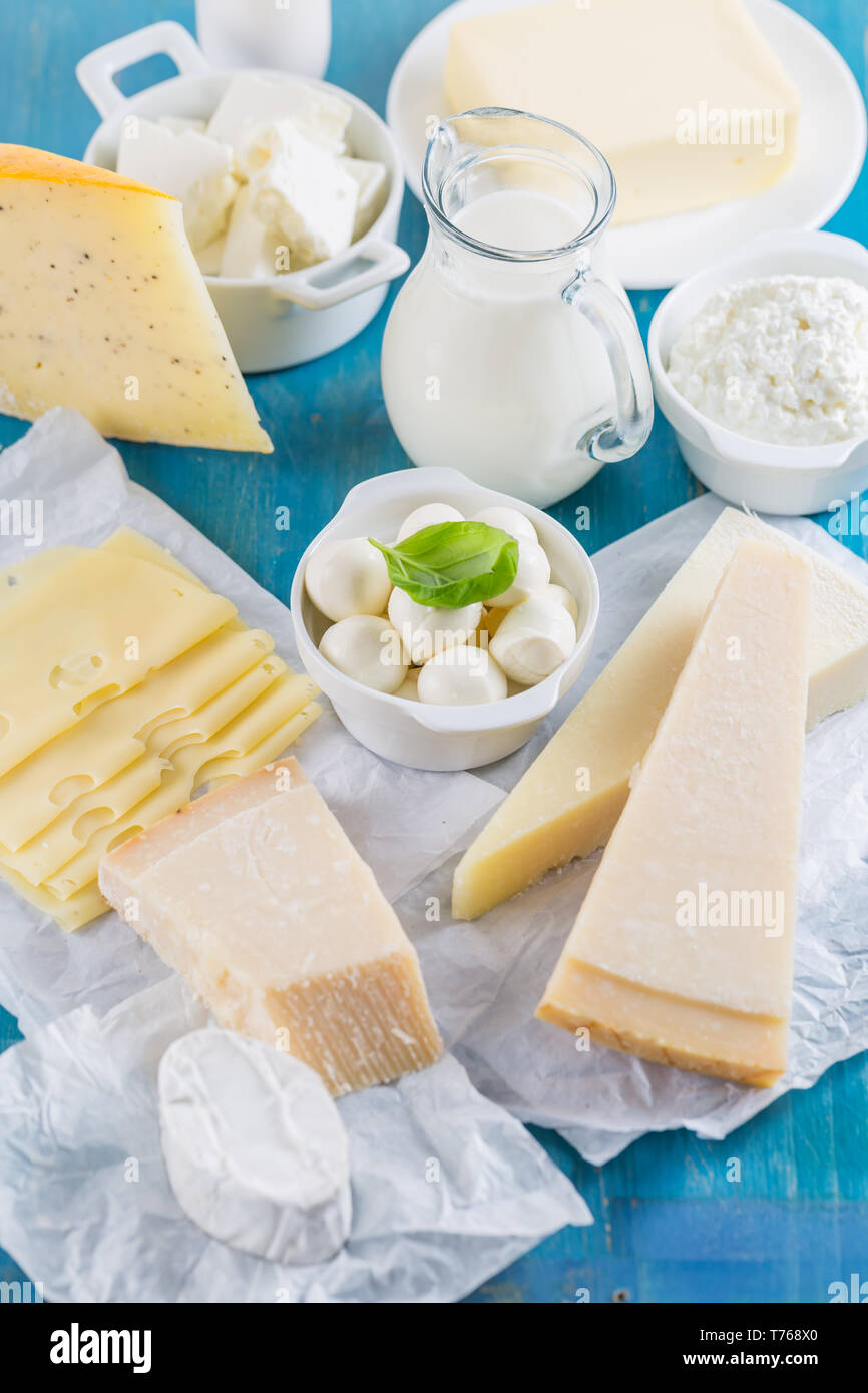 Different types of dairy products on wooden background Stock Photo - Alamy