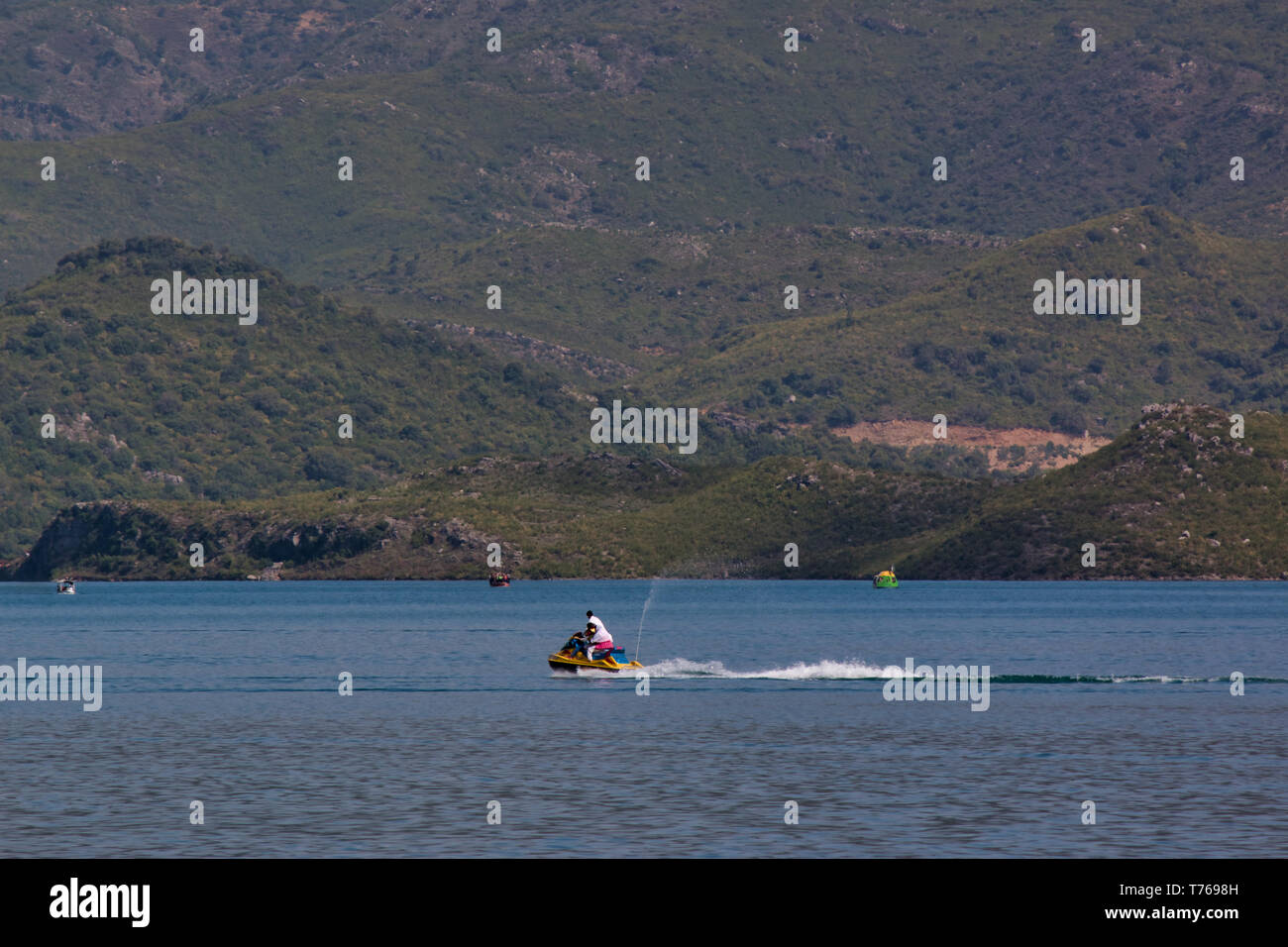 Boat sailing in the lake Stock Photo - Alamy