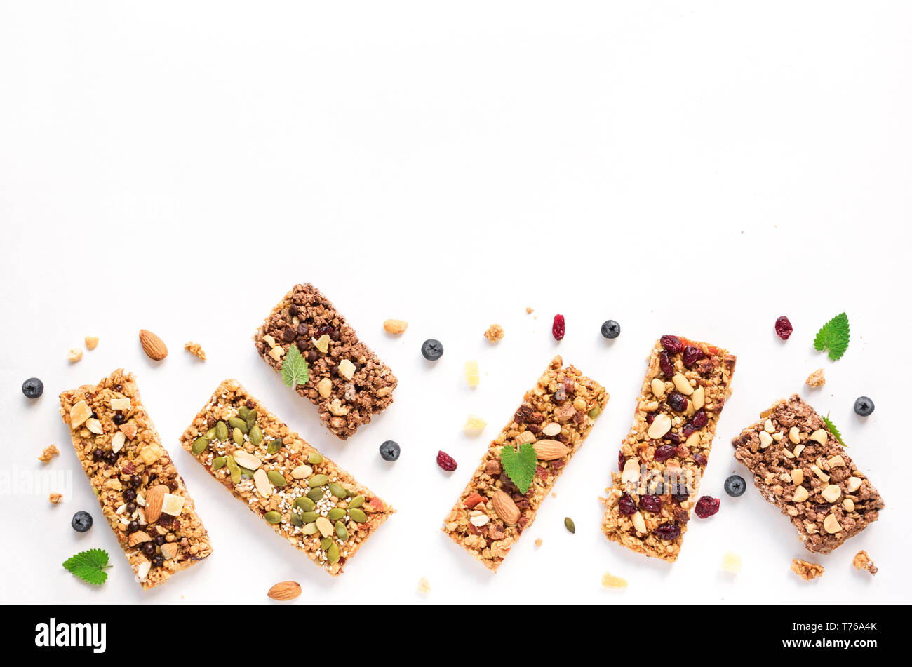 Various granola bars isolated on white background, copy space. Homemade ...