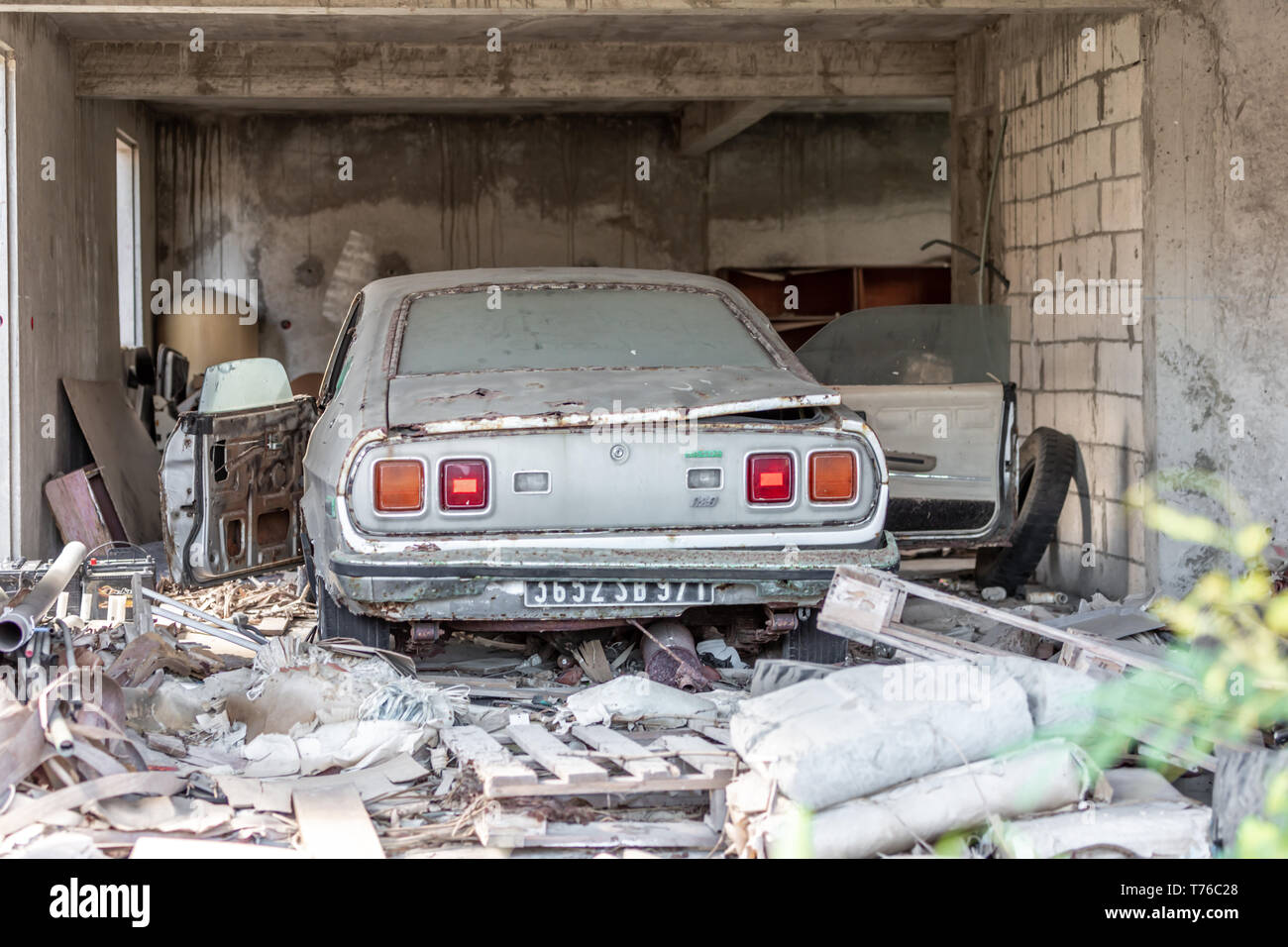 An old wrecked grey Mazada inside a ruined building in Gustavia St ...