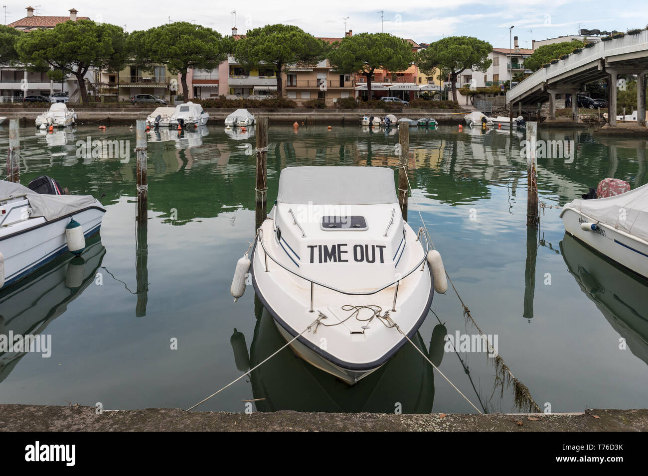 Time Out name painted on a boat moored at the Canale della Schiusa ...