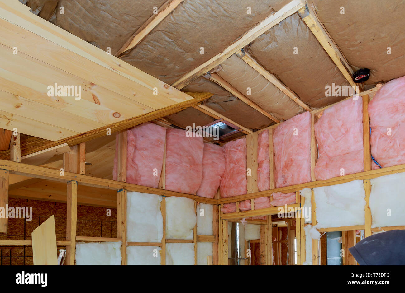 Mineral glass wool in a warming the walls with fiberglass wooden frame ...