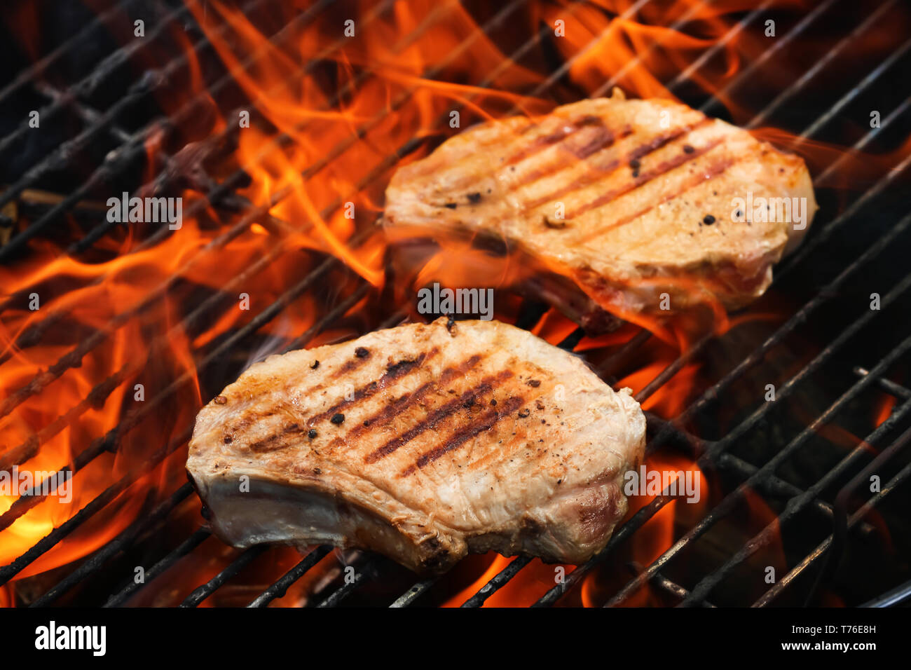 Delicious cooked meat on barbecue grill Stock Photo - Alamy